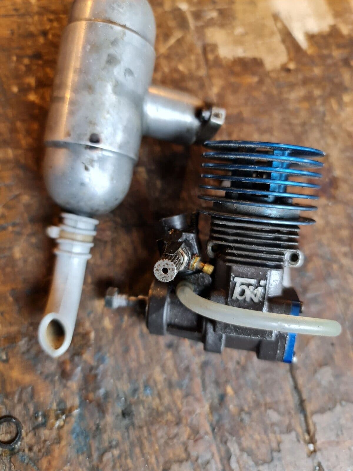 TOKI 15 HELI ENGINE C/W MUFFLER LIGHTLY OIL STAINED, RUNS WELL ...